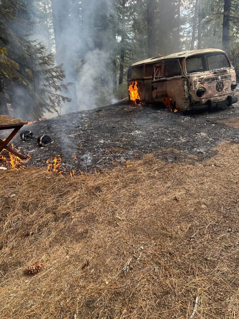 Vehicle Fire Spreads Igniting Nearby Vegetation